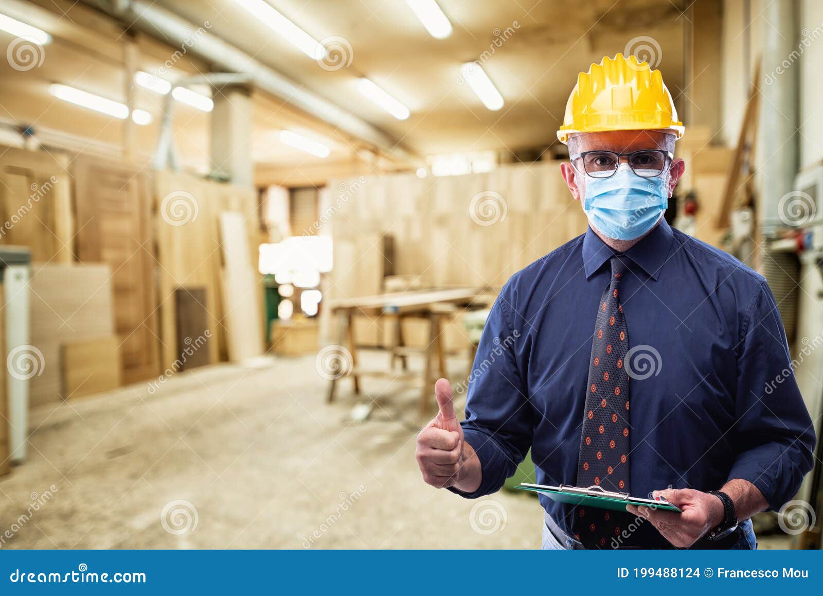 Engineer at Work Protects the Face with the Surgical Mask. Construction ...