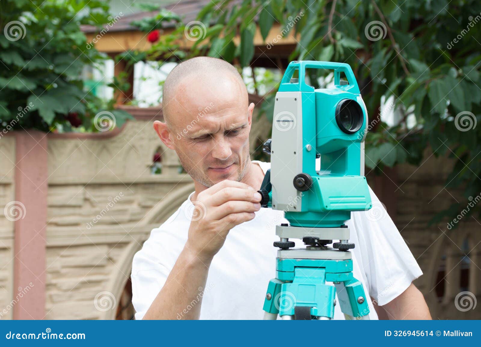 An Engineer at Work with a Total Station Device Stock Photo - Image of ...