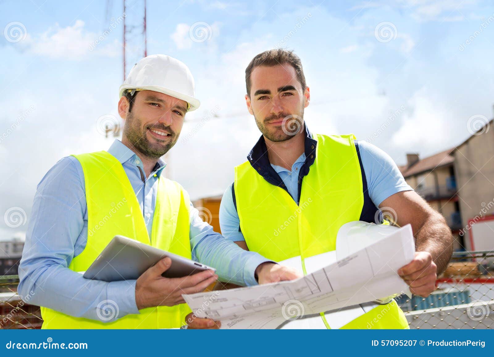 Engineer and Worker Checking Plan on Construction Site Stock Image ...