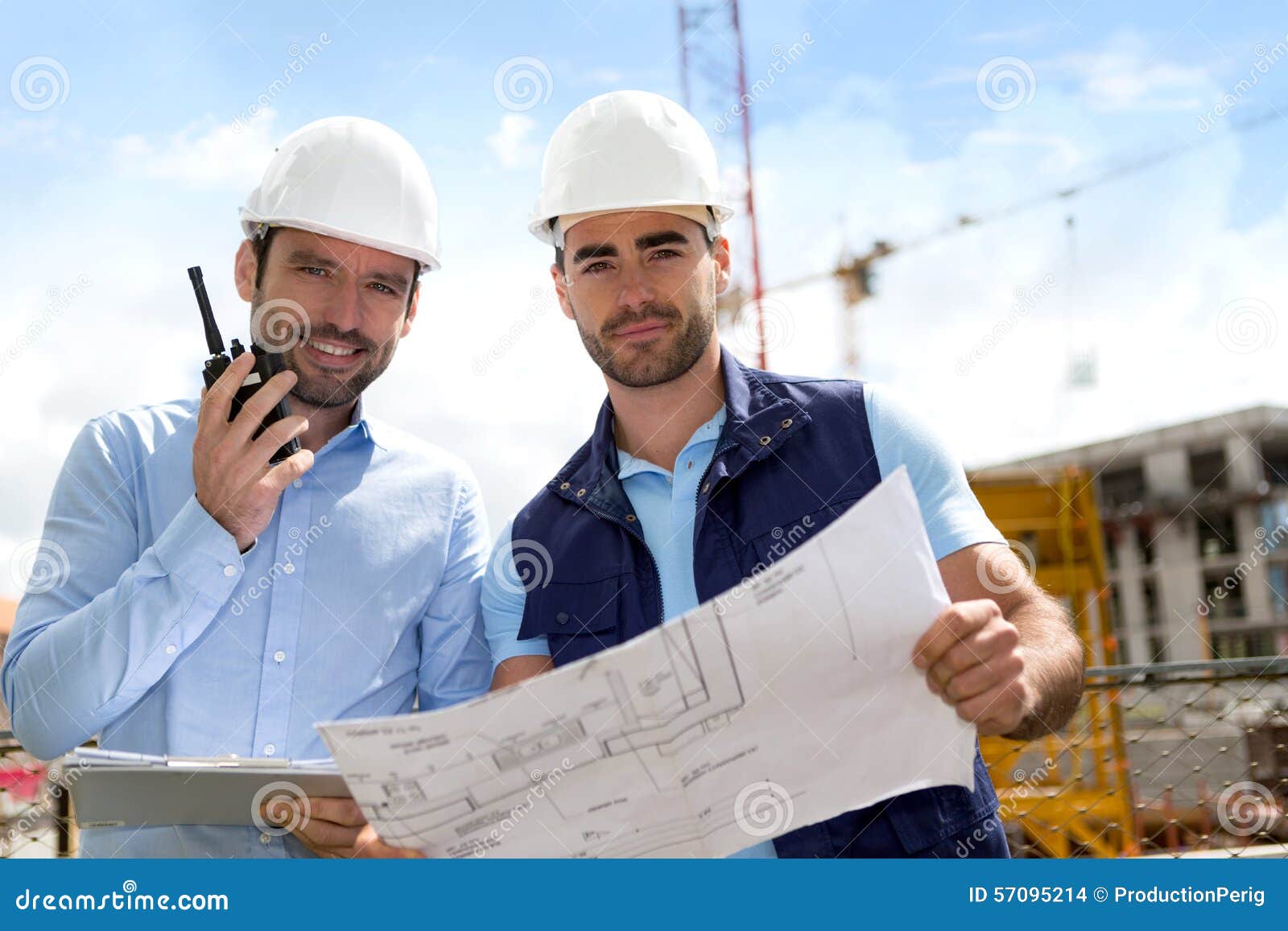 Engineer and Worker Checking Plan on Construction Site Stock Photo ...