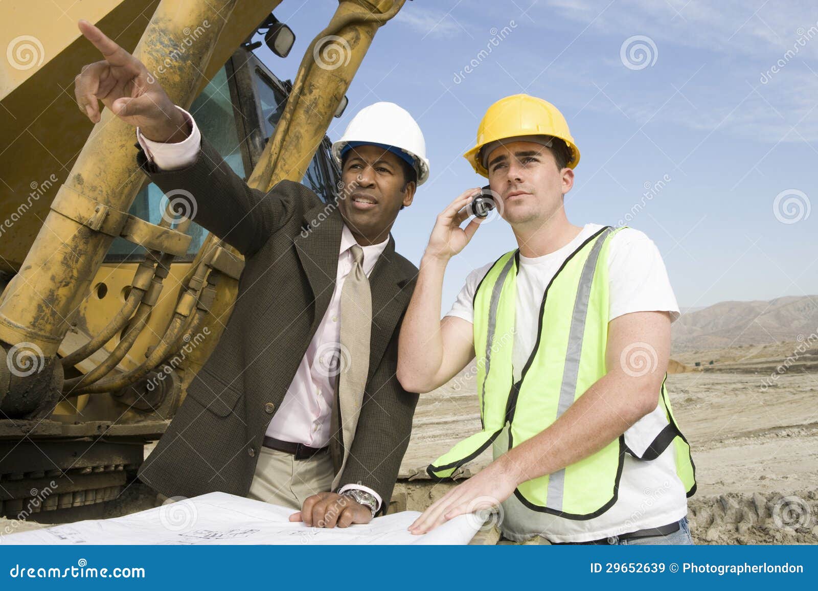 Engineer with Worker at Construction Site Stock Image - Image of ...