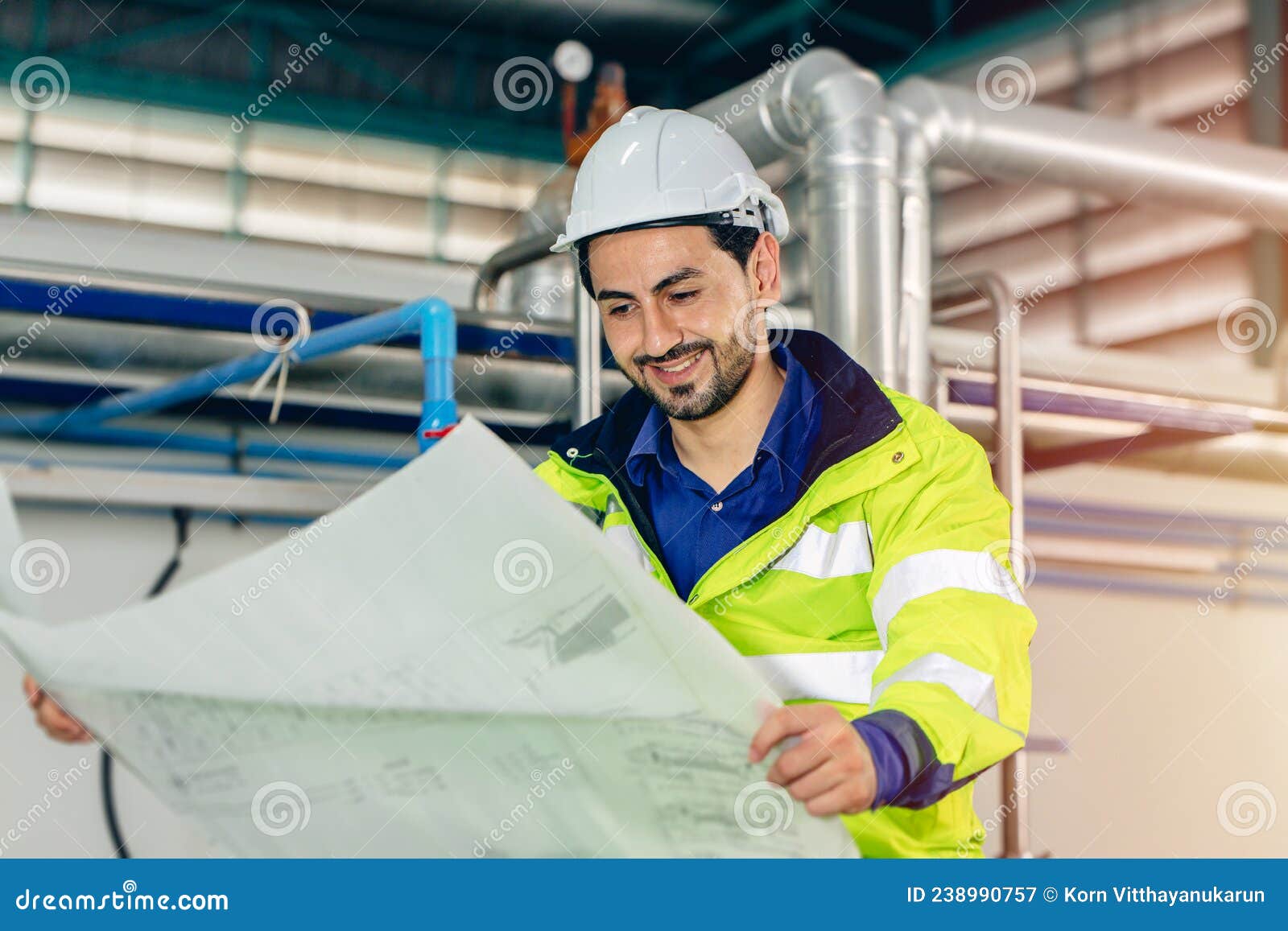 Engineer Worker with Floor Plan Blueprint Paper of Machine Service ...