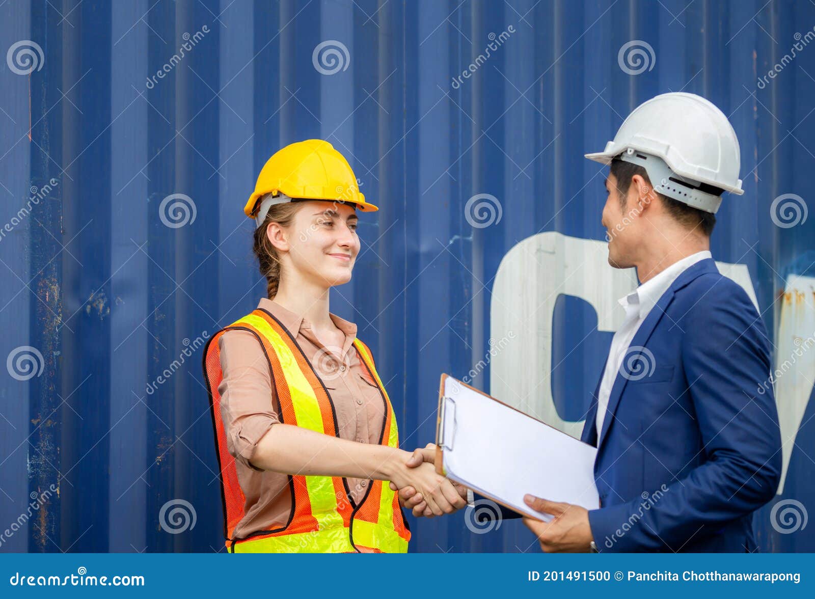 Engineer And Worker Handshake At Containers Cargo Success And Teamwork