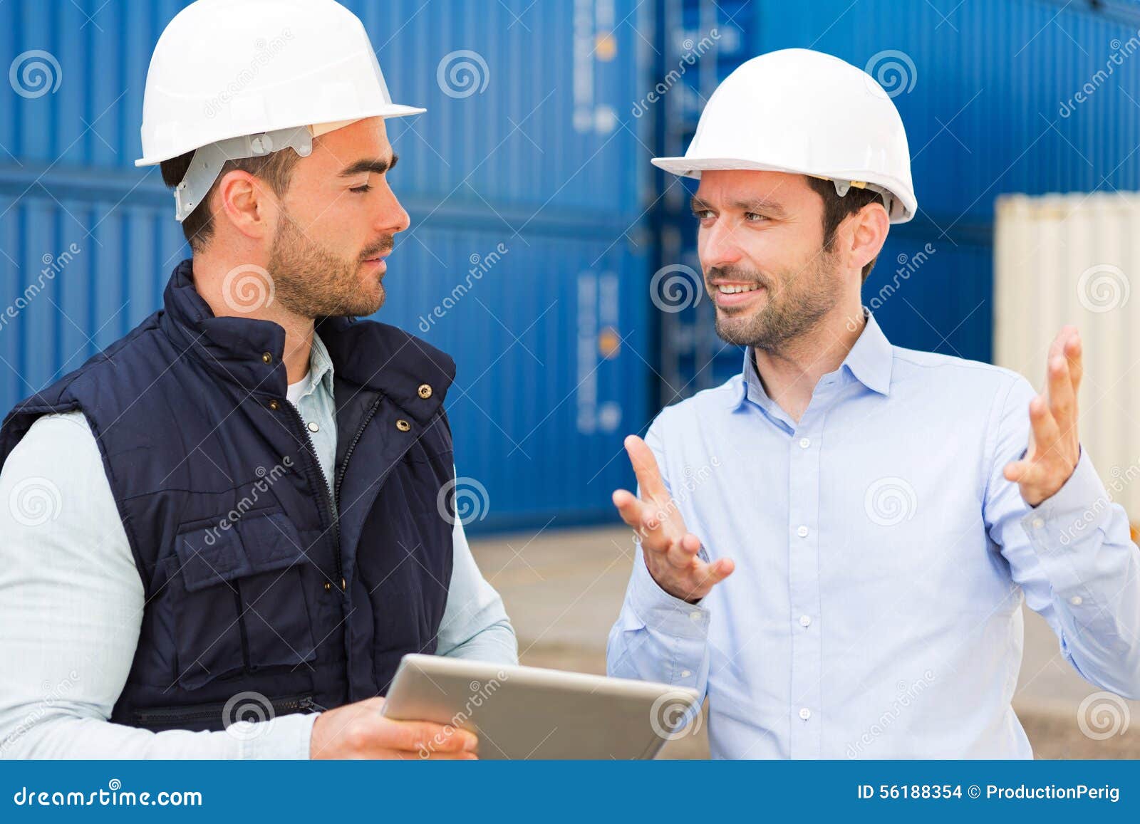 Engineer and Worker Speaking about Work on the Dock Stock Photo - Image ...
