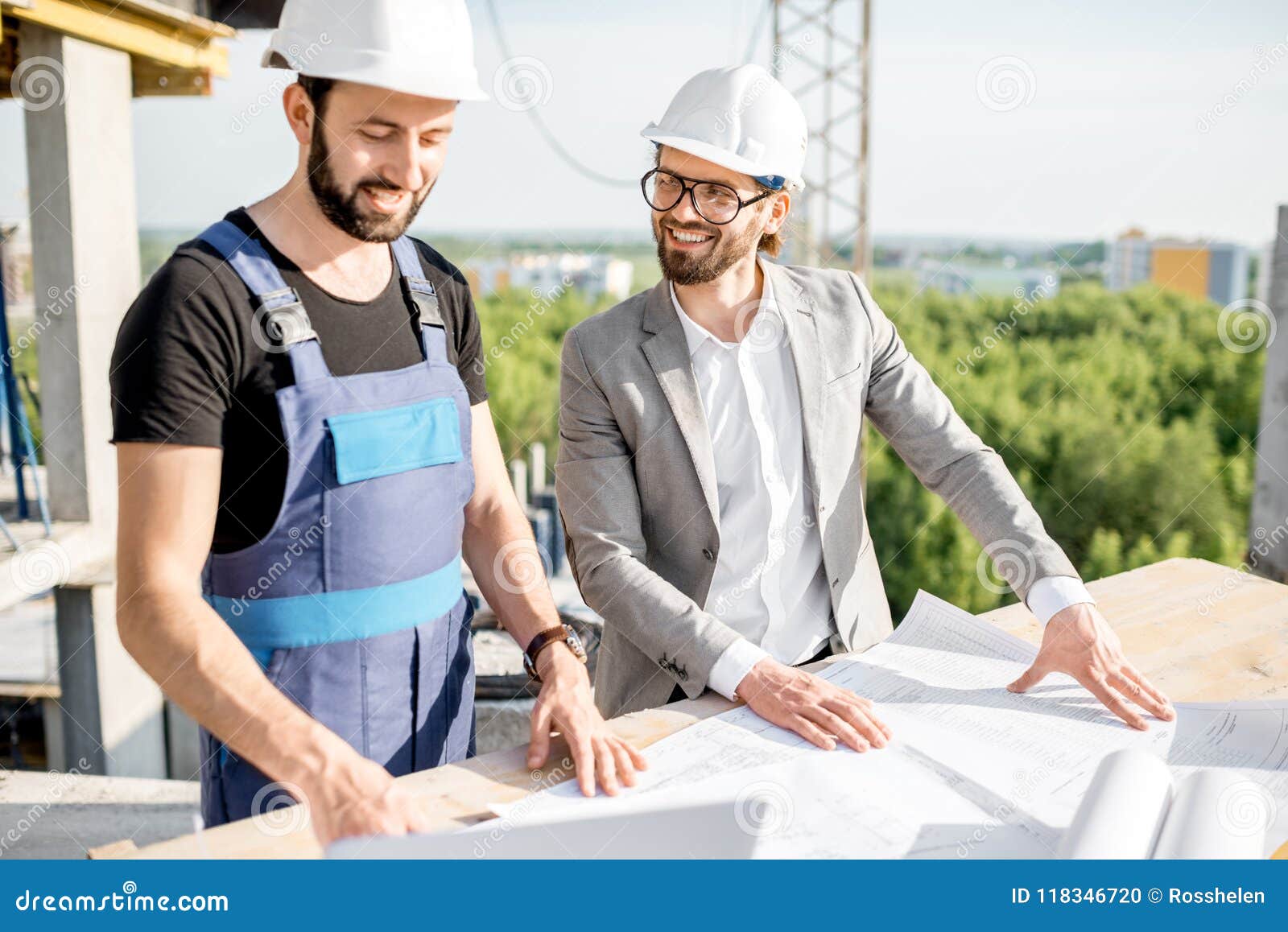 Engineer with Worker at the Construction Site Stock Photo - Image of ...