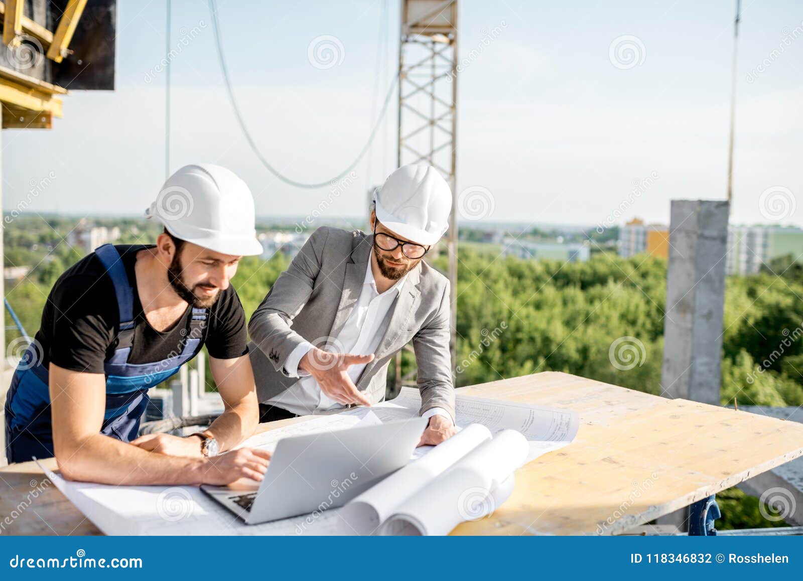 Engineer with Worker at the Construction Site Stock Photo - Image of ...