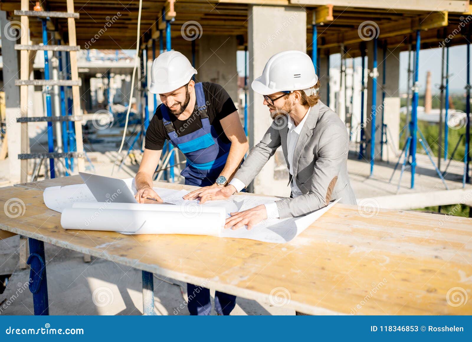 Engineer with Worker at the Construction Site Stock Image - Image of ...