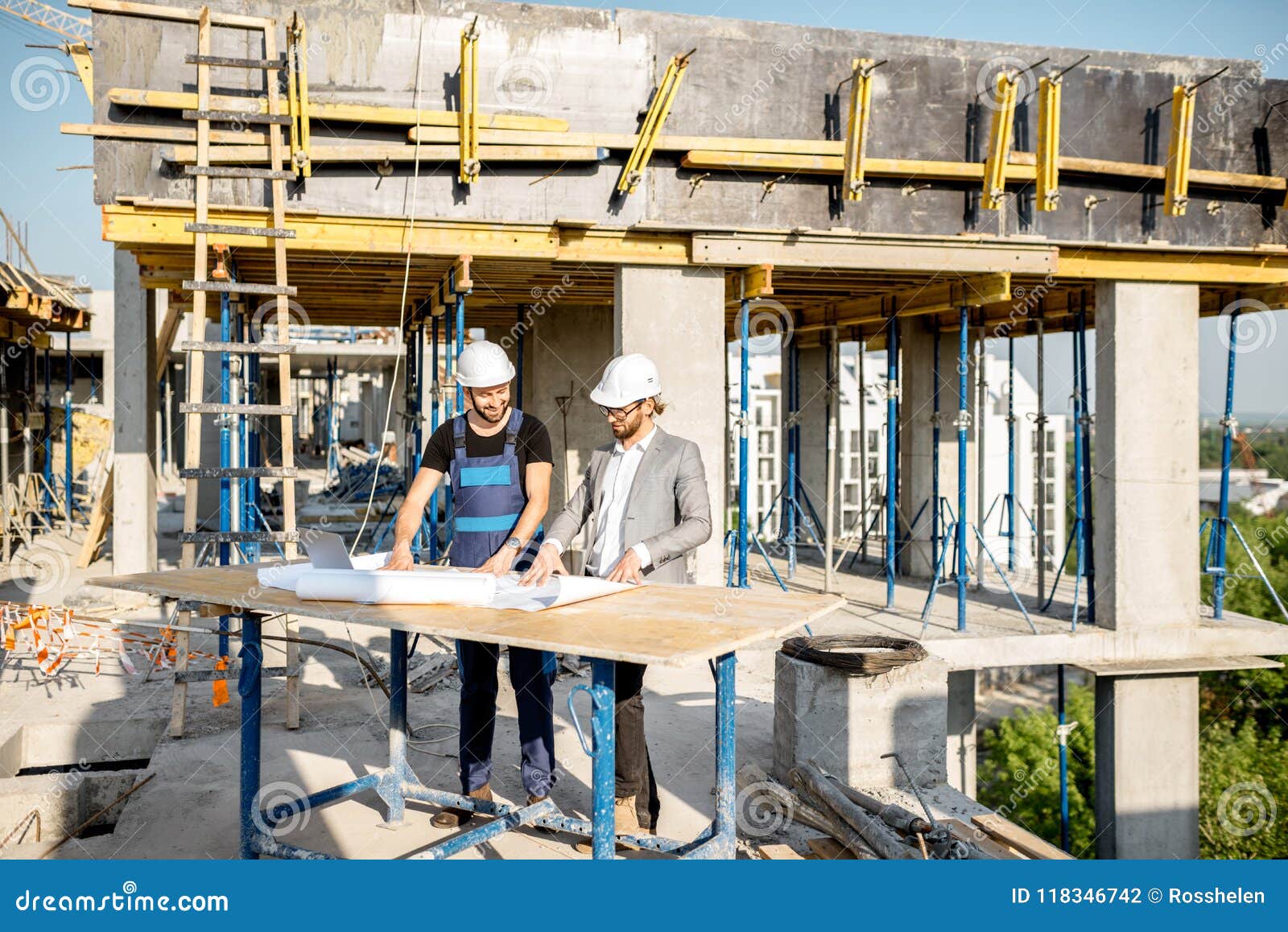 Engineer with Worker at the Construction Site Stock Photo - Image of ...