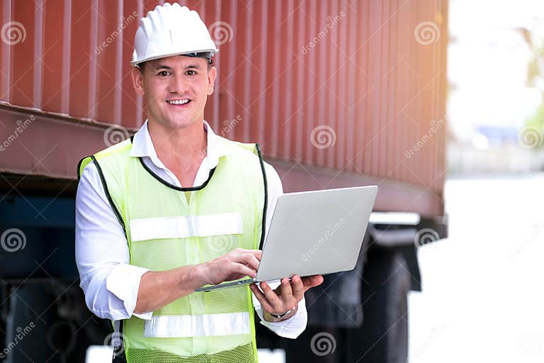 Engineer Worker Used a Laptop or Computer To Control Loading Containers ...