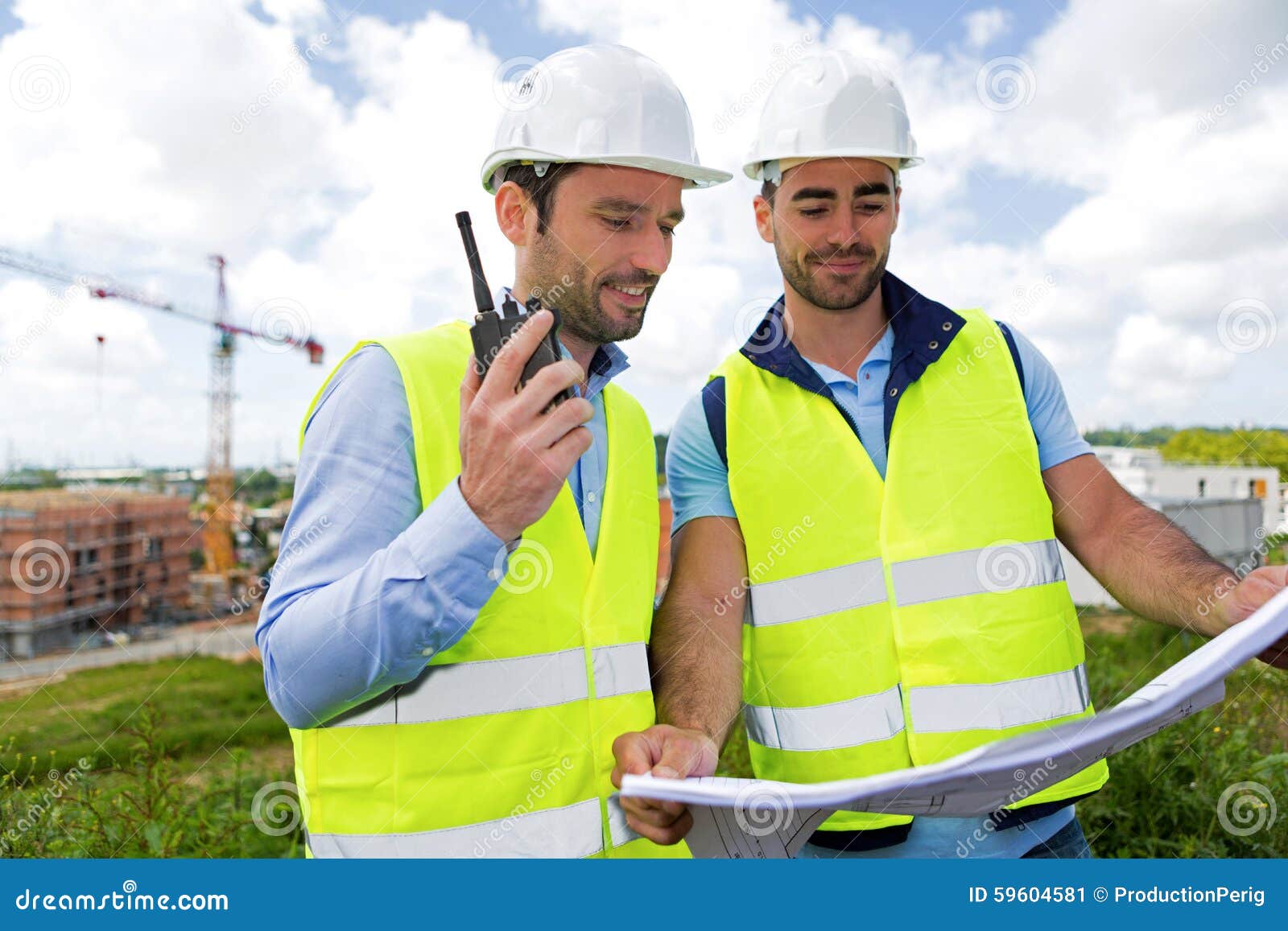 Engineer and Worker Watching Blueprint on Construction Site Stock Image ...