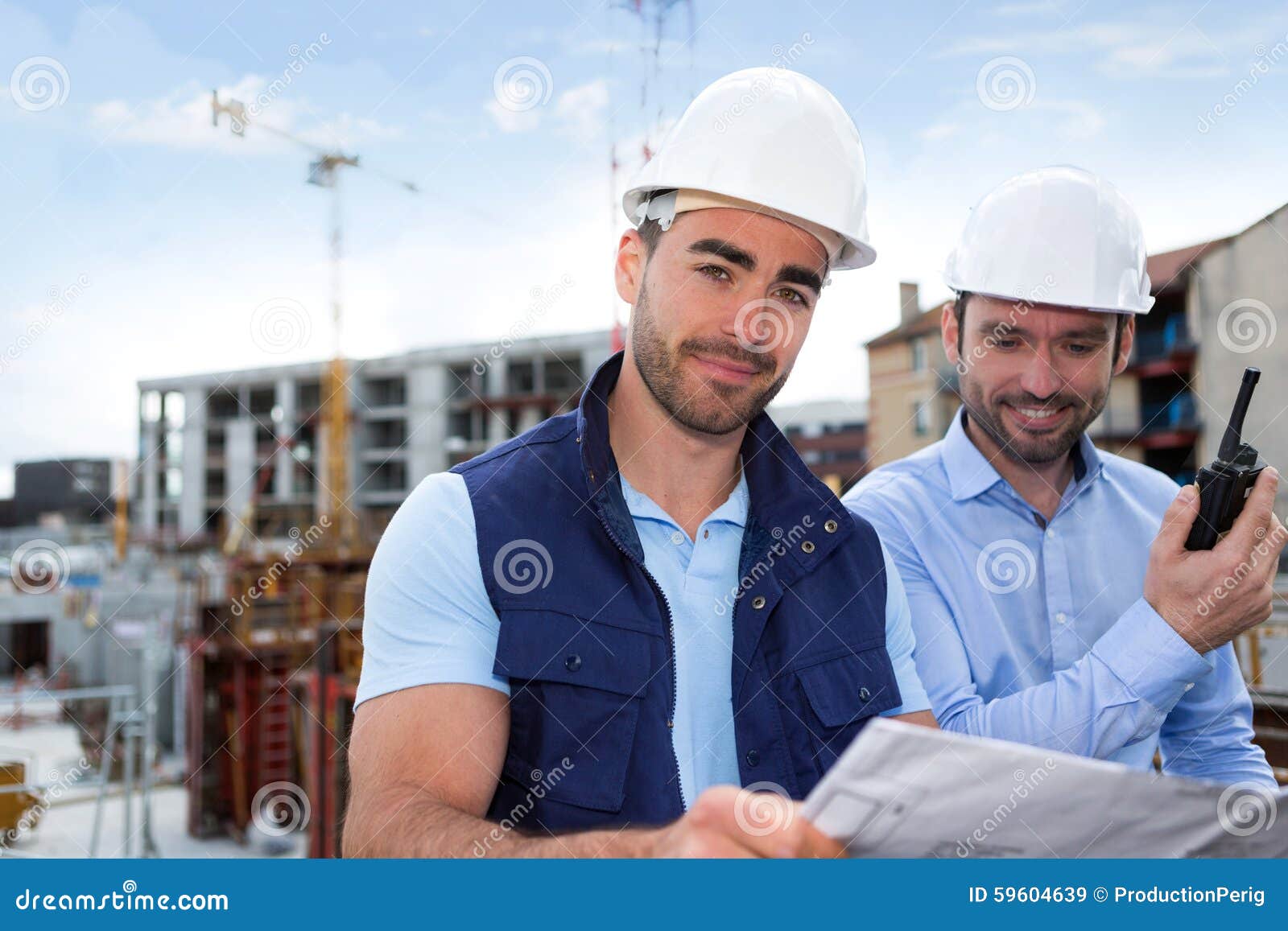 Engineer and Worker Watching Blueprint on Construction Site Stock Image ...