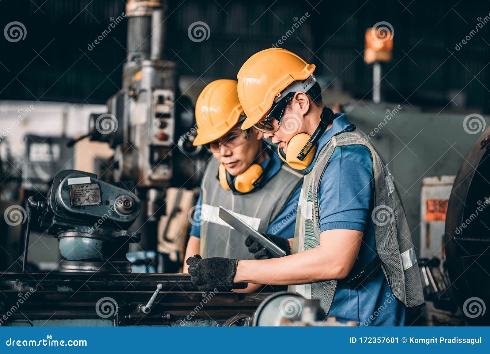 Engineer Looking of Working at Industrial Machinery Setup in Factory ...