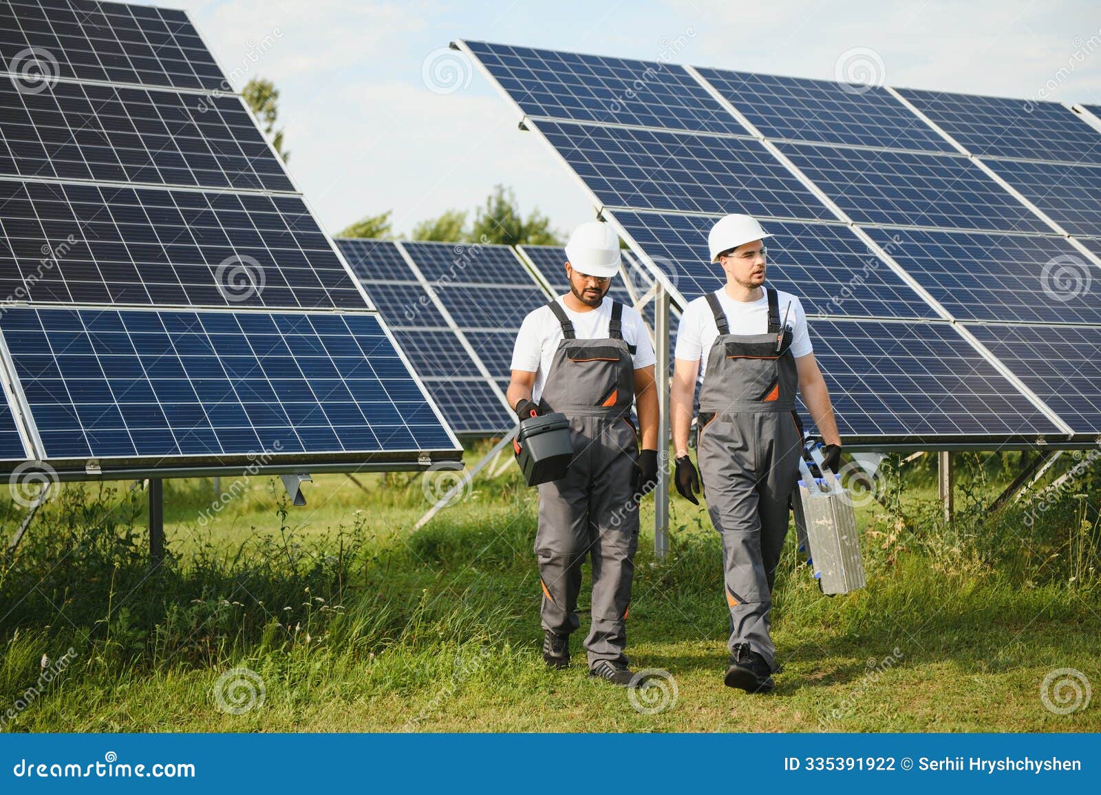 Engineer Worker Working in Solar Panels Power Farm. Two Technician ...