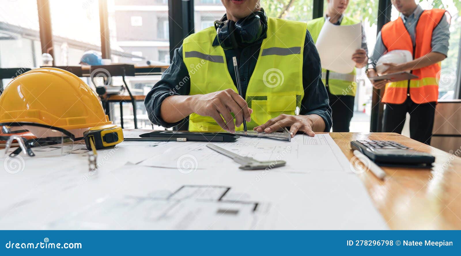 Engineer Working on Blueprints and Construction Plans. Building ...
