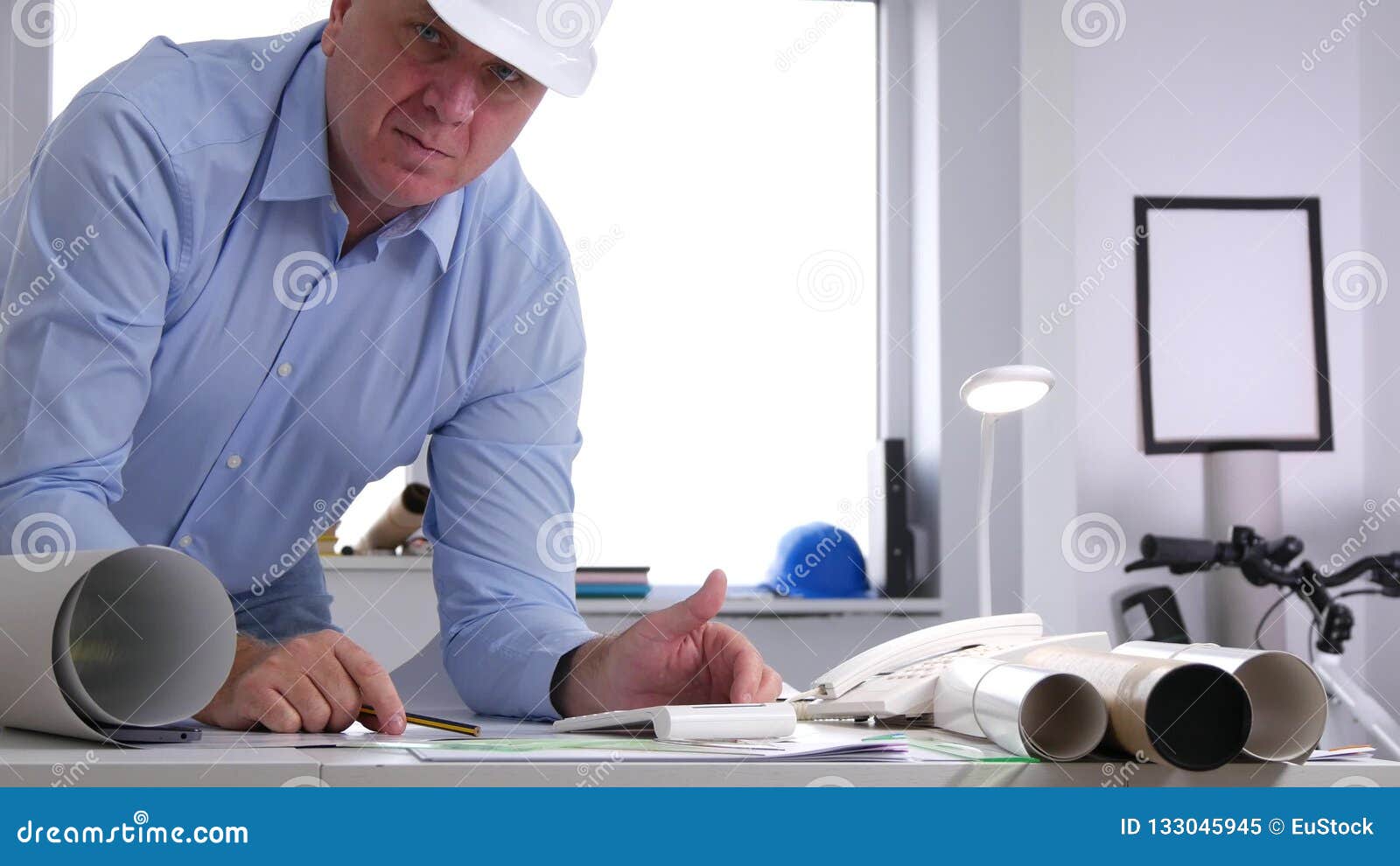 Engineer Working with Building Plans Make Calculation with Adding ...