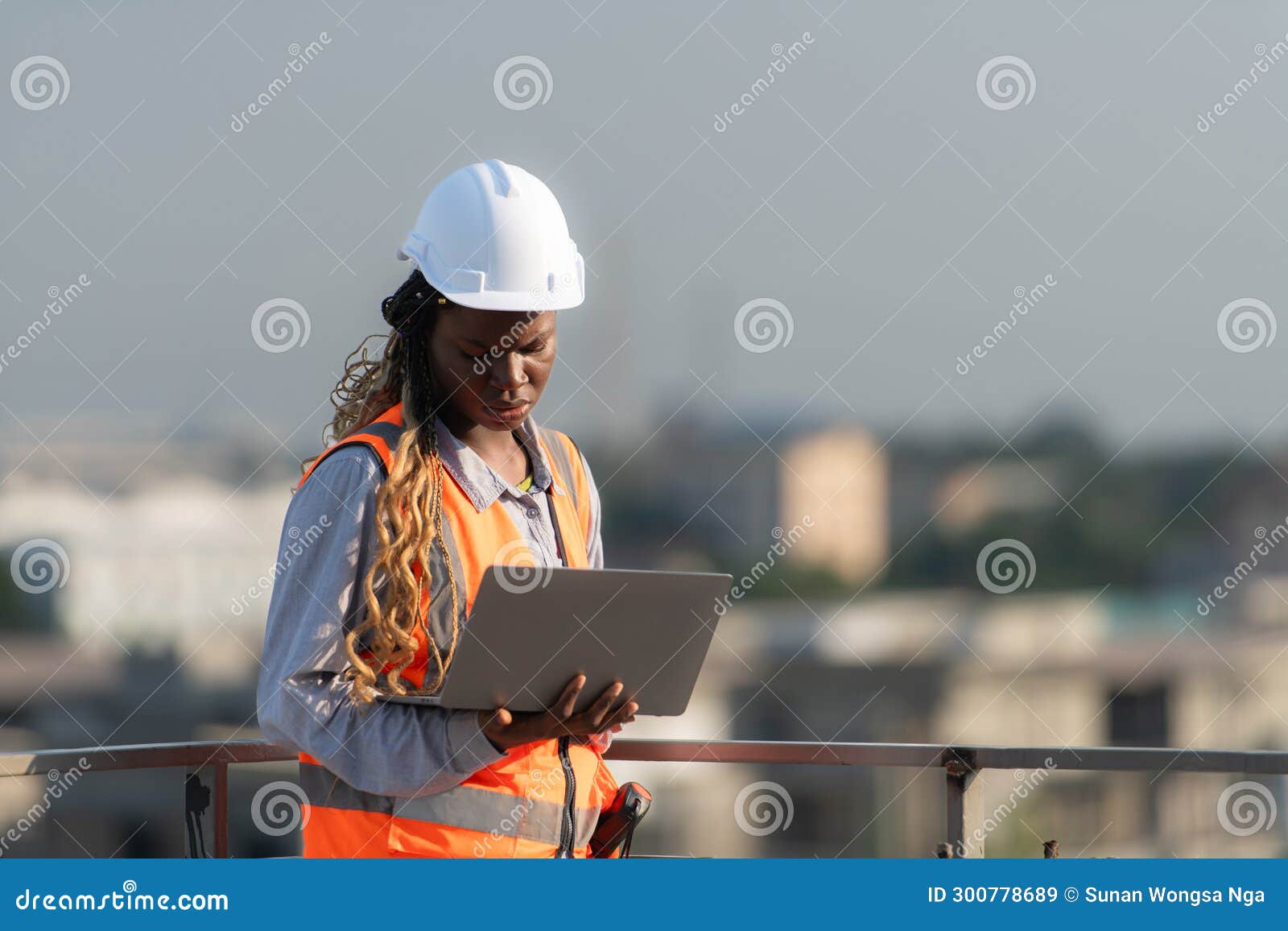 Engineer Working on a Building Site the Telephone and Internet Network ...
