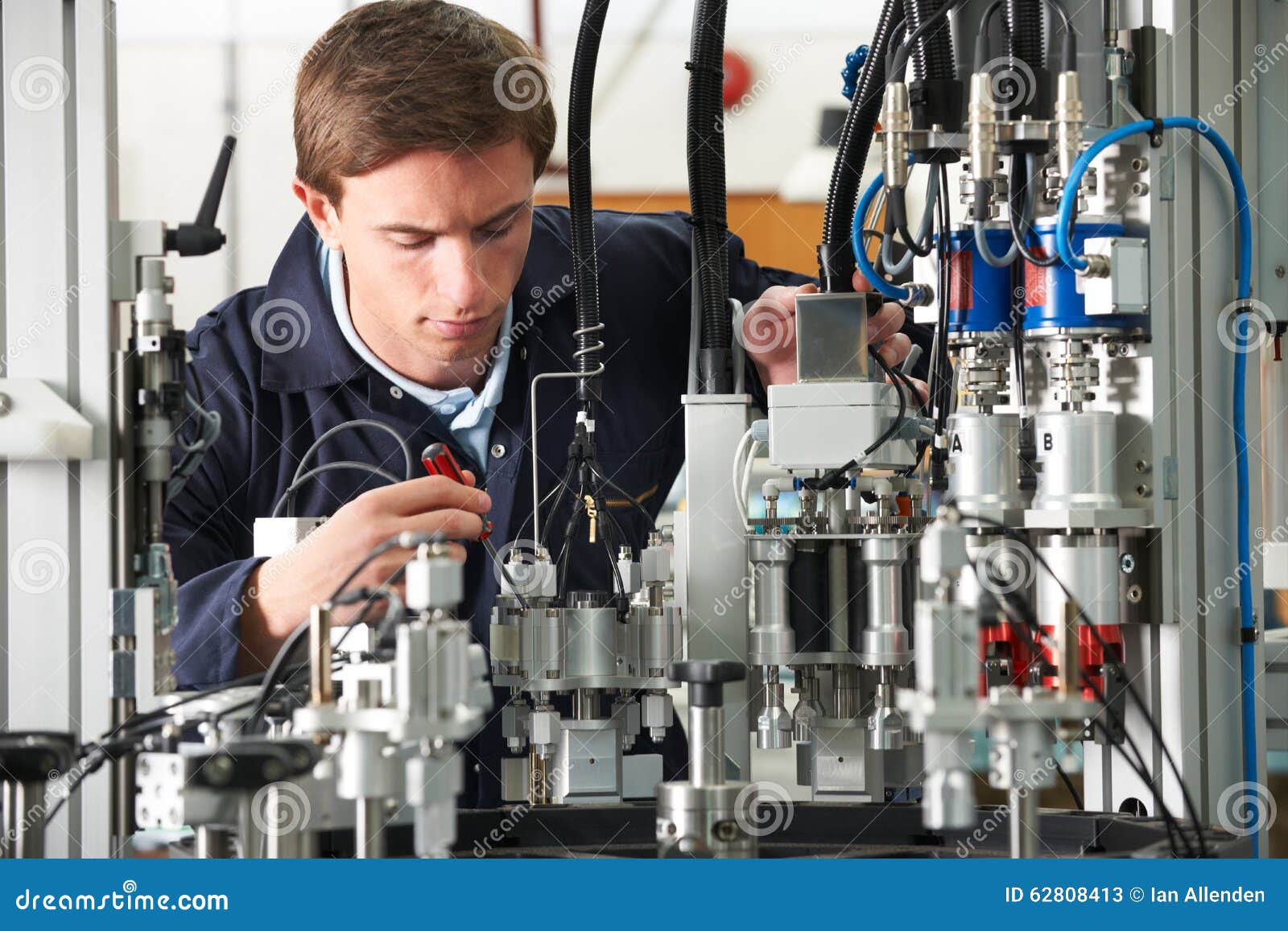 Engineer Working on Complex Equipment in Factory Stock Image - Image of ...