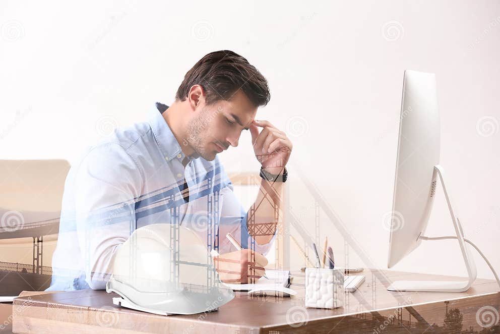 Engineer Working with Computer at Table in Office and Pedestrian Bridge ...