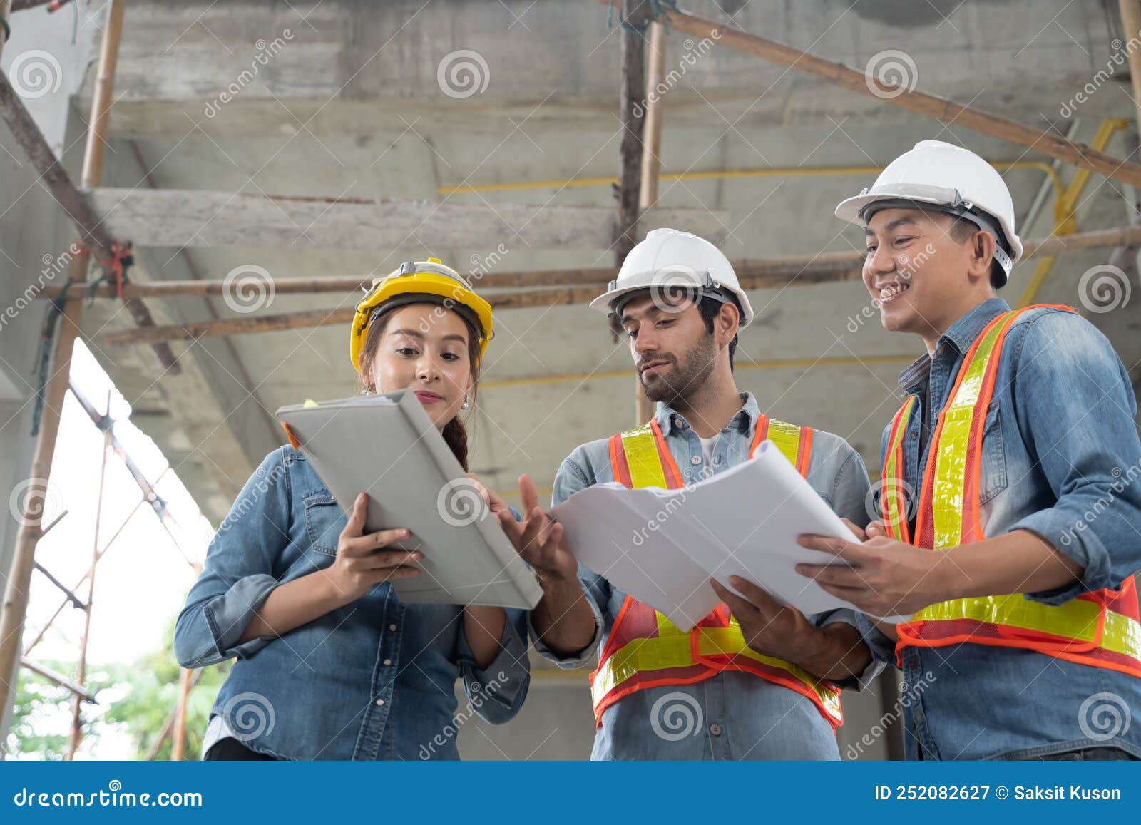 Engineer Working at Construction Site Meeting and Discussing on Laptop ...