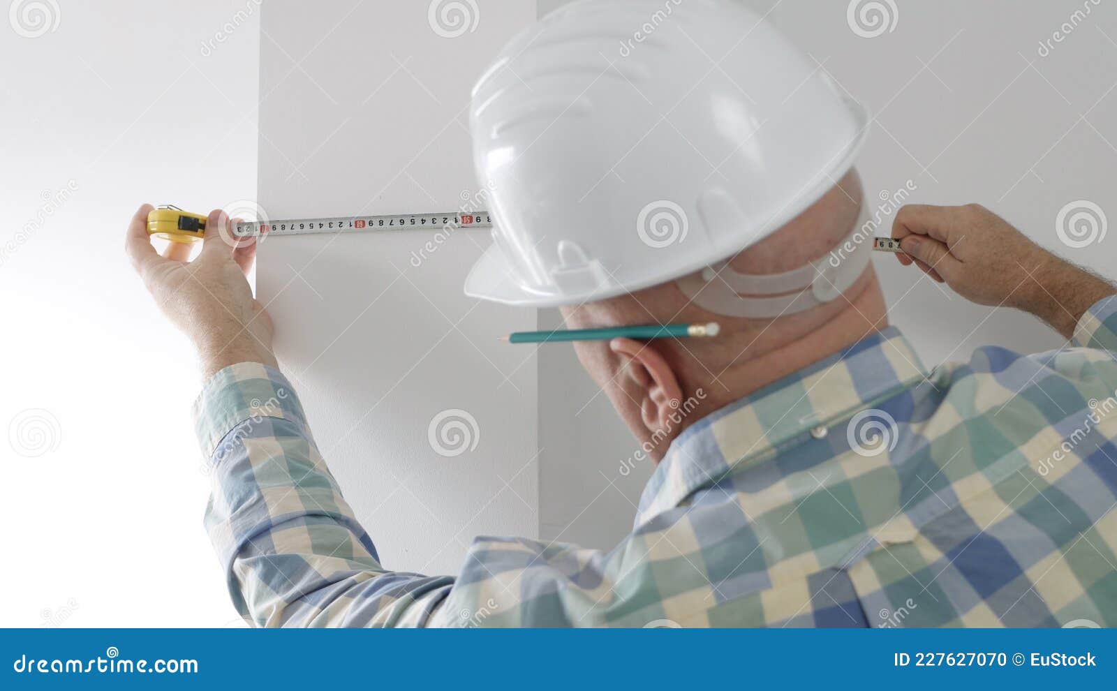 Engineer Working in a Construction Site Use a Tape Measure and Check ...