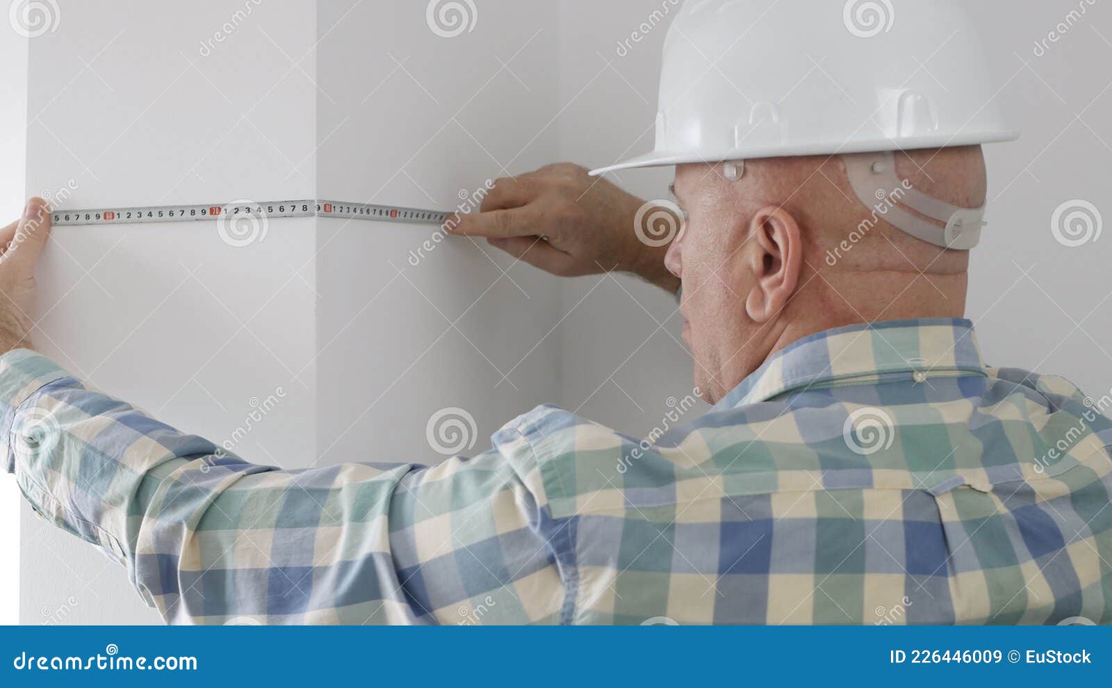 Engineer Working in a Construction Site Use a Tape Measure and Check ...