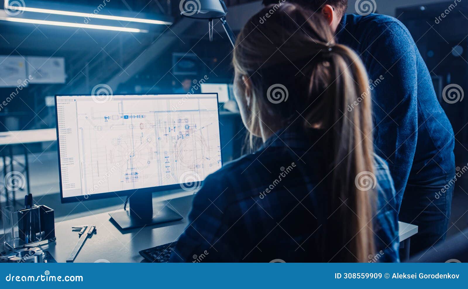 Engineer Working on Desktop Computer, Screen Showing CAD Software with ...