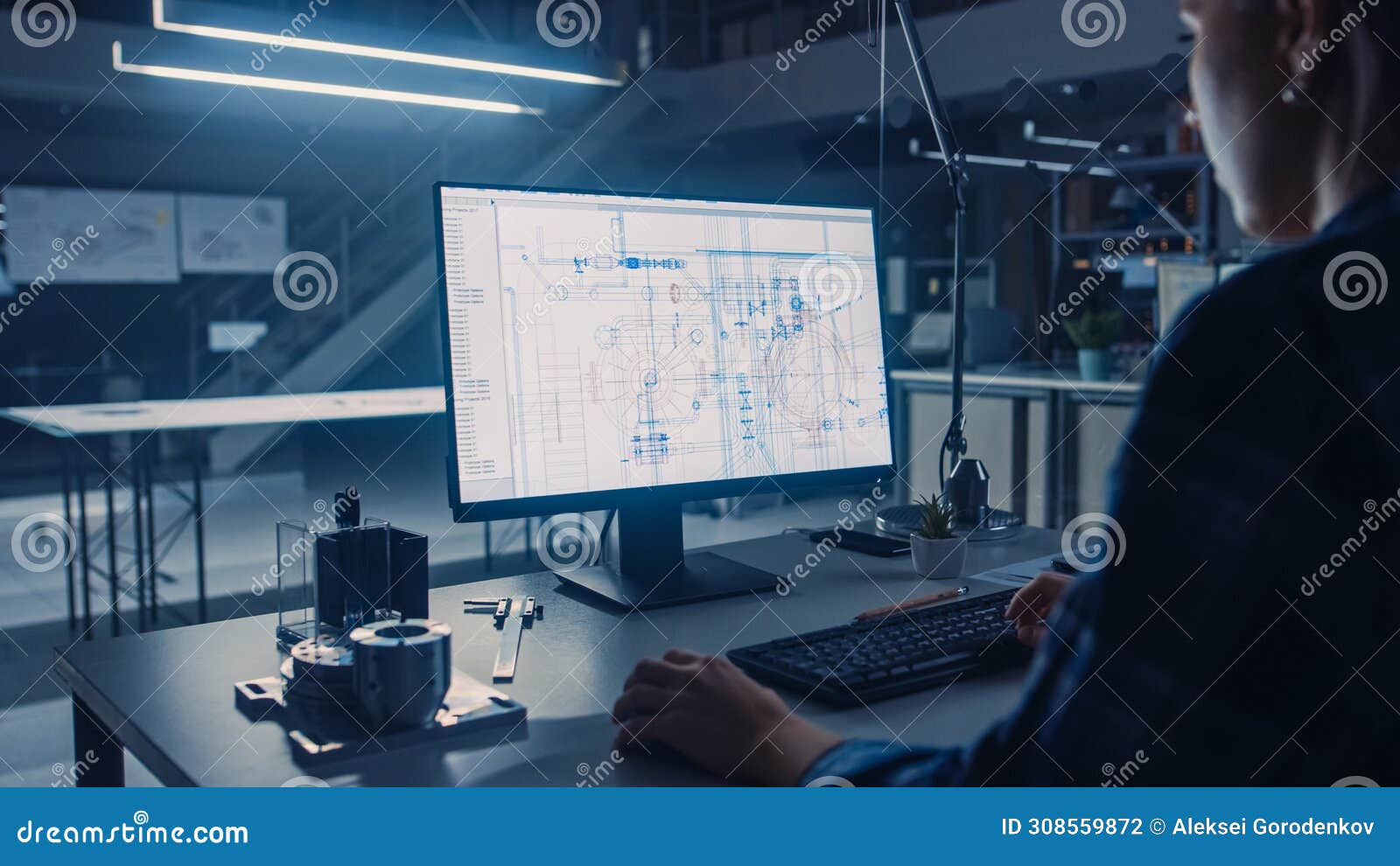 Engineer Working on Desktop Computer, Screen Showing CAD Software with ...
