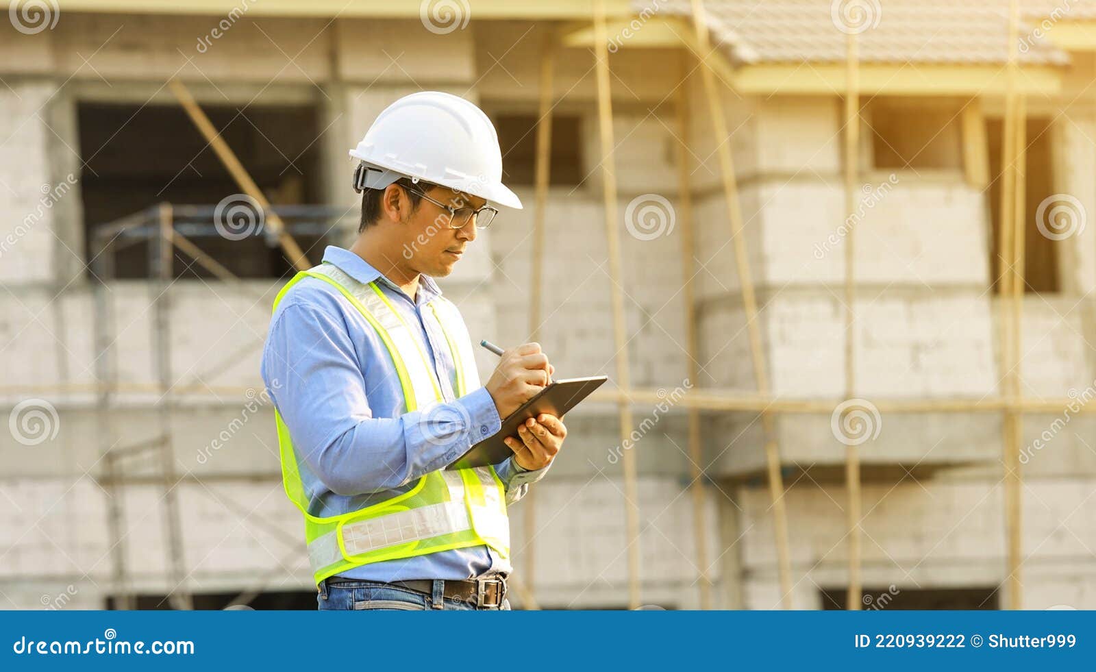 Engineer Working on Digital Tablet at Construction Site Stock Photo ...