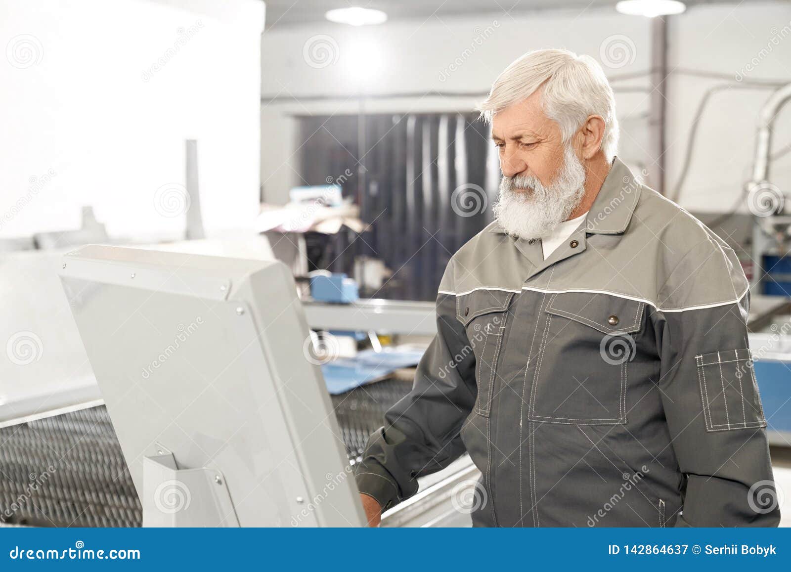 Engineer Working on Factory with Computerized Machine. Stock Image ...