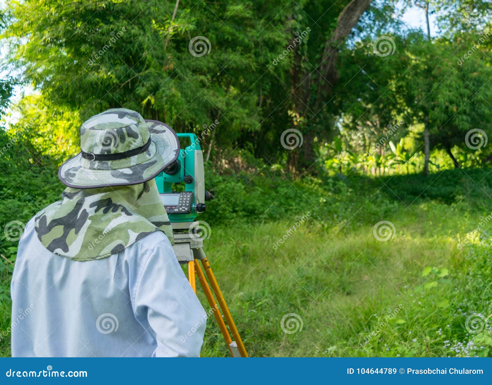 Engineer is Working with Level-measuring Instrument for Survey Stock ...