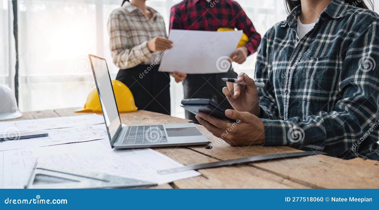 Engineer Working in Office, Engineer and Architect Use Calculator for ...