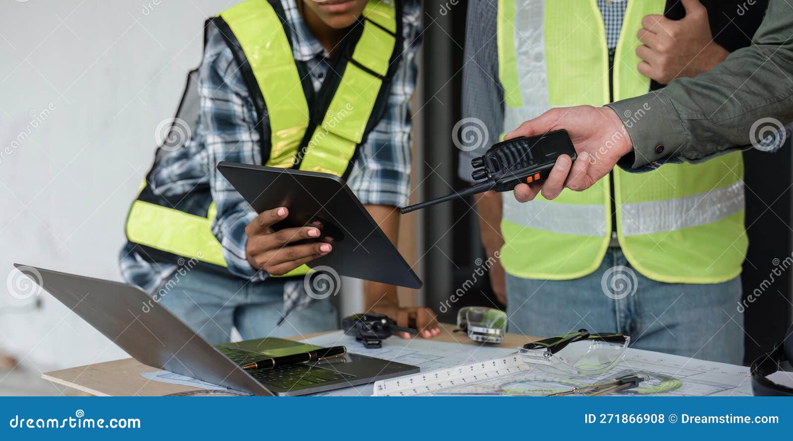 Engineer Working in Office with Blueprints , Walkie Talkie, Tablet ...