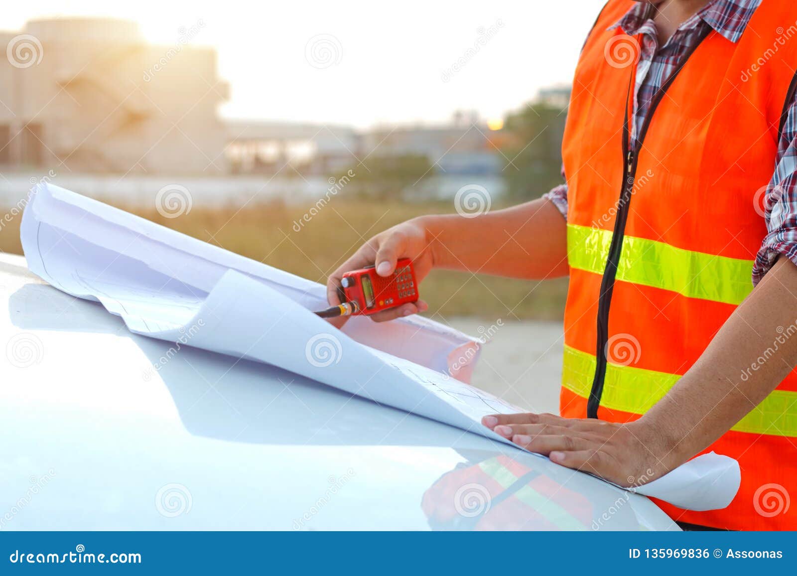 Engineer Working on Outdoor Checking Plan on Building Site Stock Photo ...