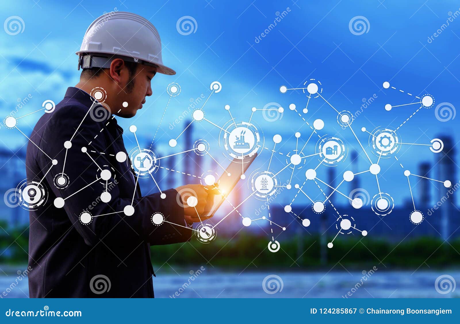 The Engineer is Working with Tabet with Large Industry Background ...