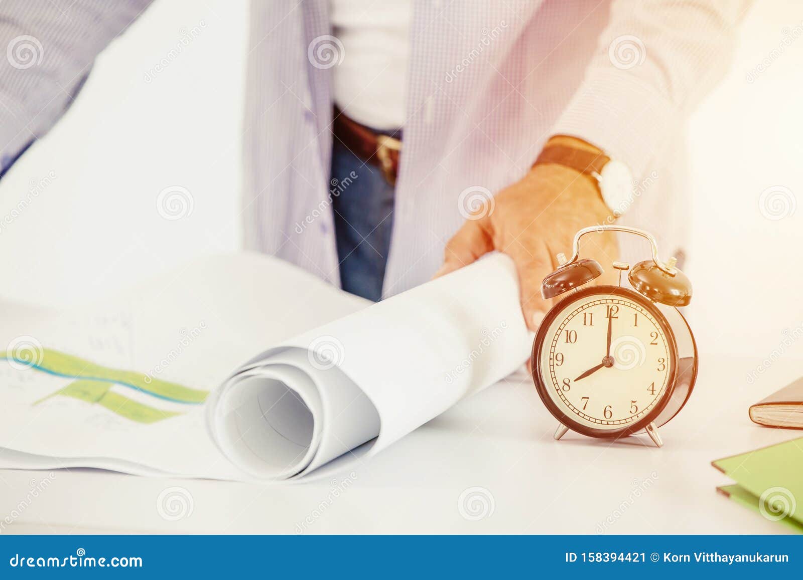 Engineer Working Times Clock Looking Building Plan on Desk in the ...