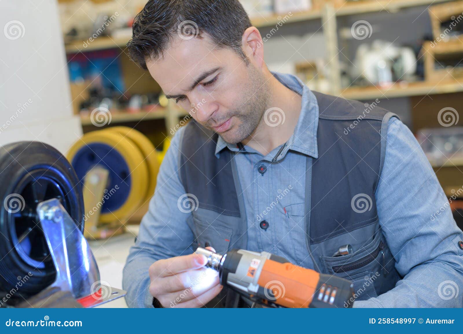 Engineer working on wheel stock image. Image of building - 258548997