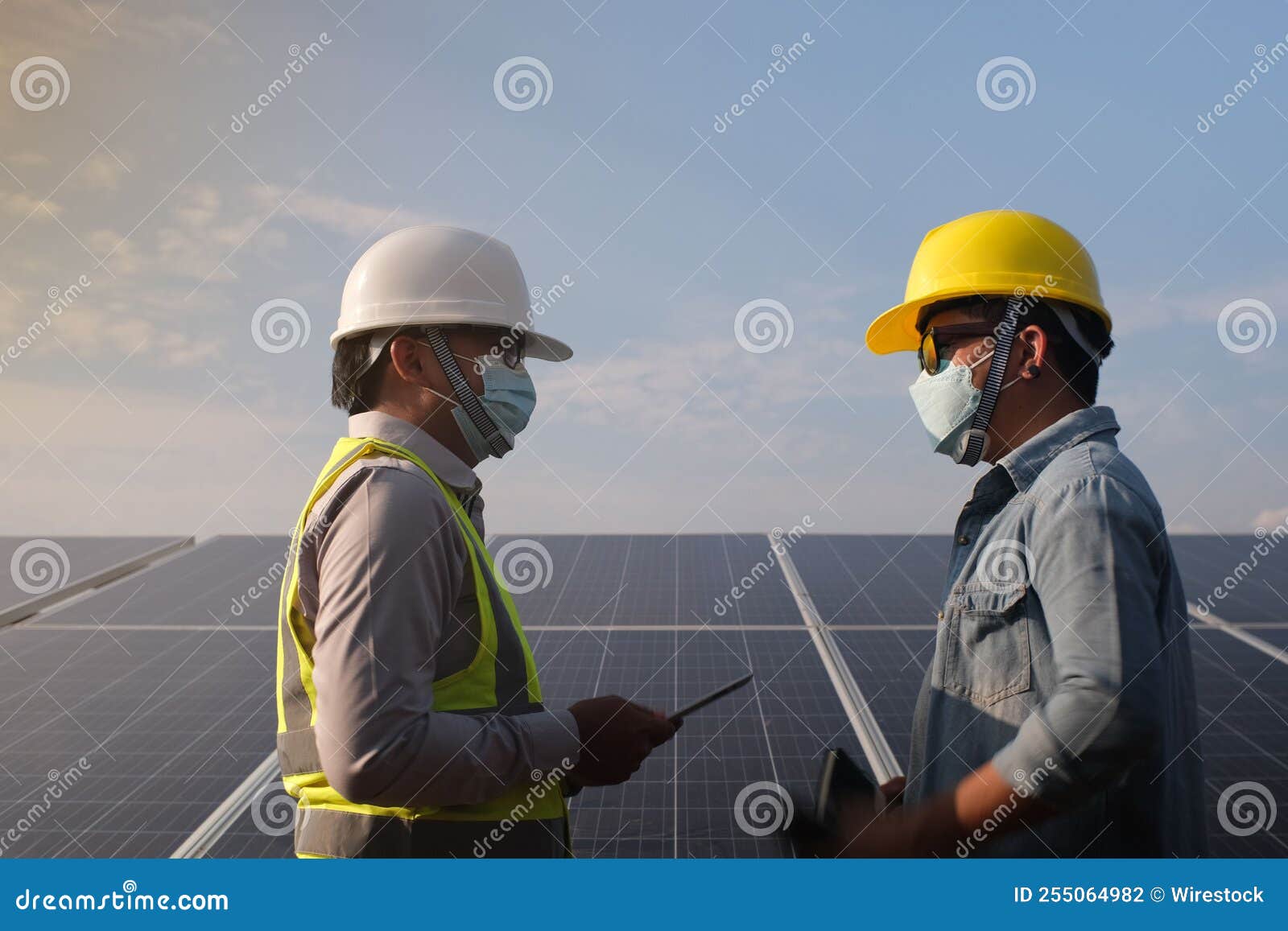 Engineer Working with Workers Working As a Team Against the Back Stock ...