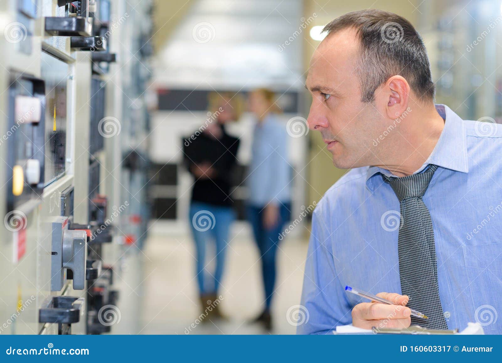 Engineer Writing on Clipboard in Factory Stock Image - Image of ...
