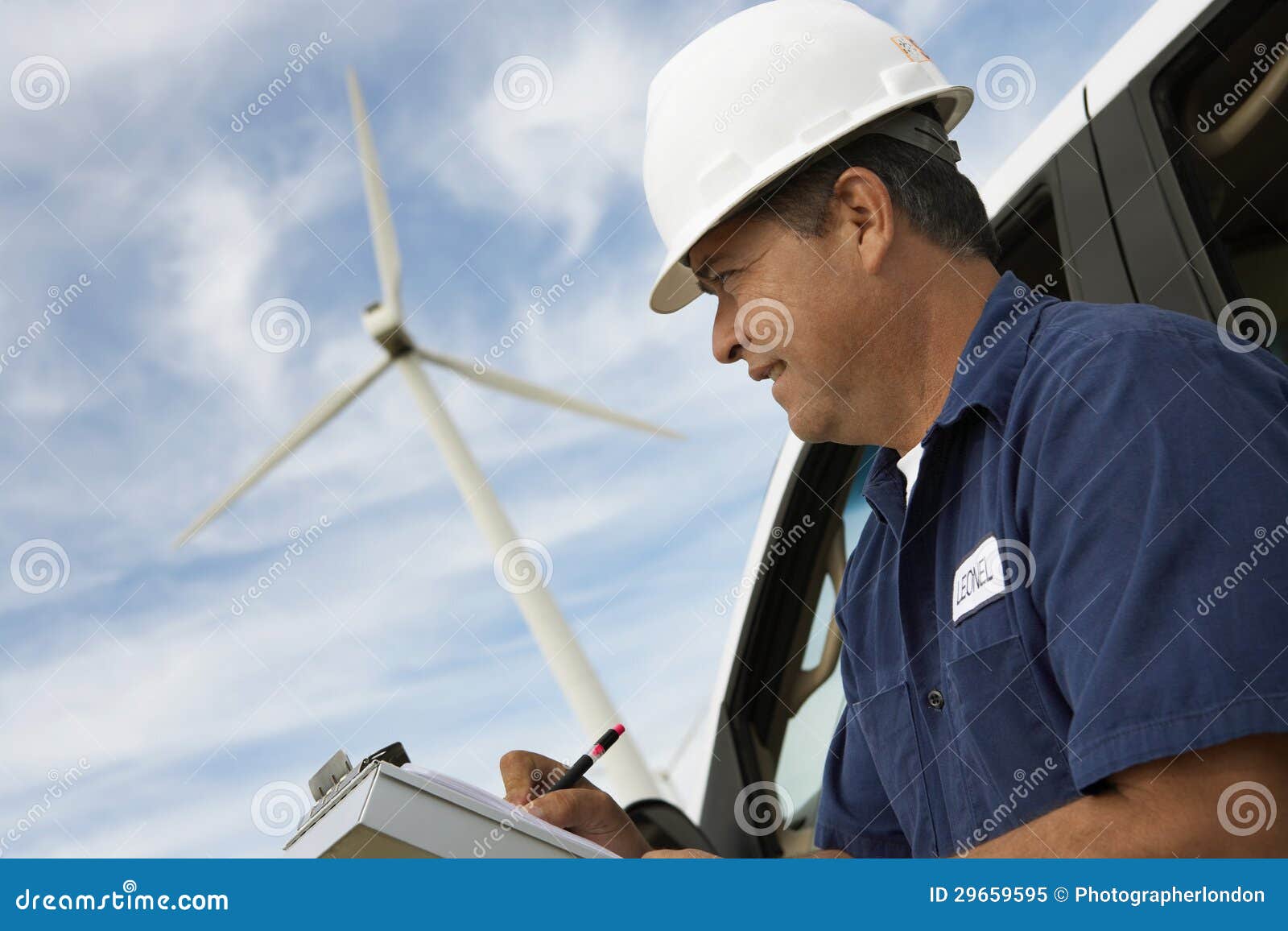 Engineer Writing on Clipboard at Wind Farm Stock Image - Image of ...