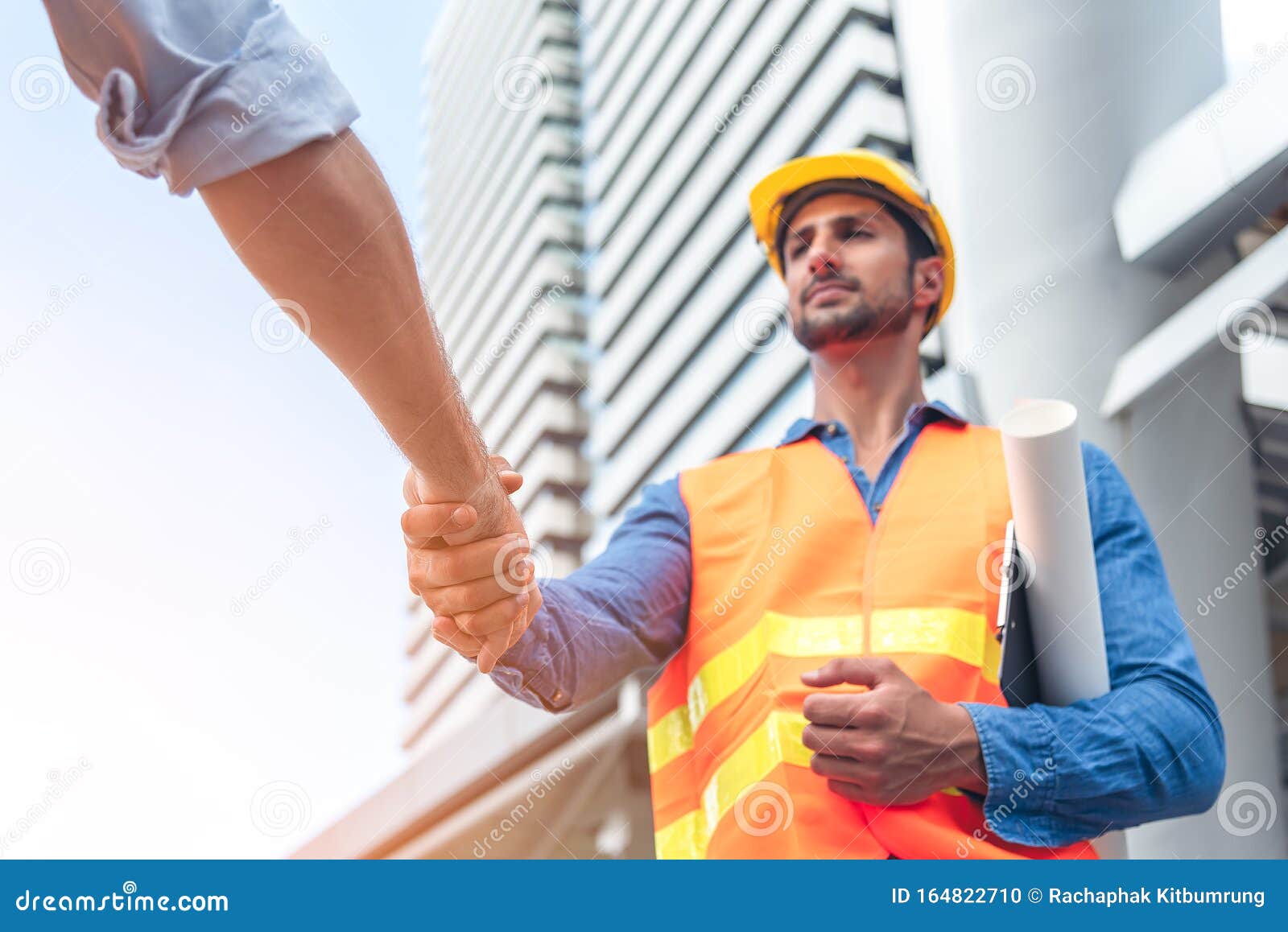 Engineer in Yellow Helmet and Best Greeting with Warm Handshake Manager ...