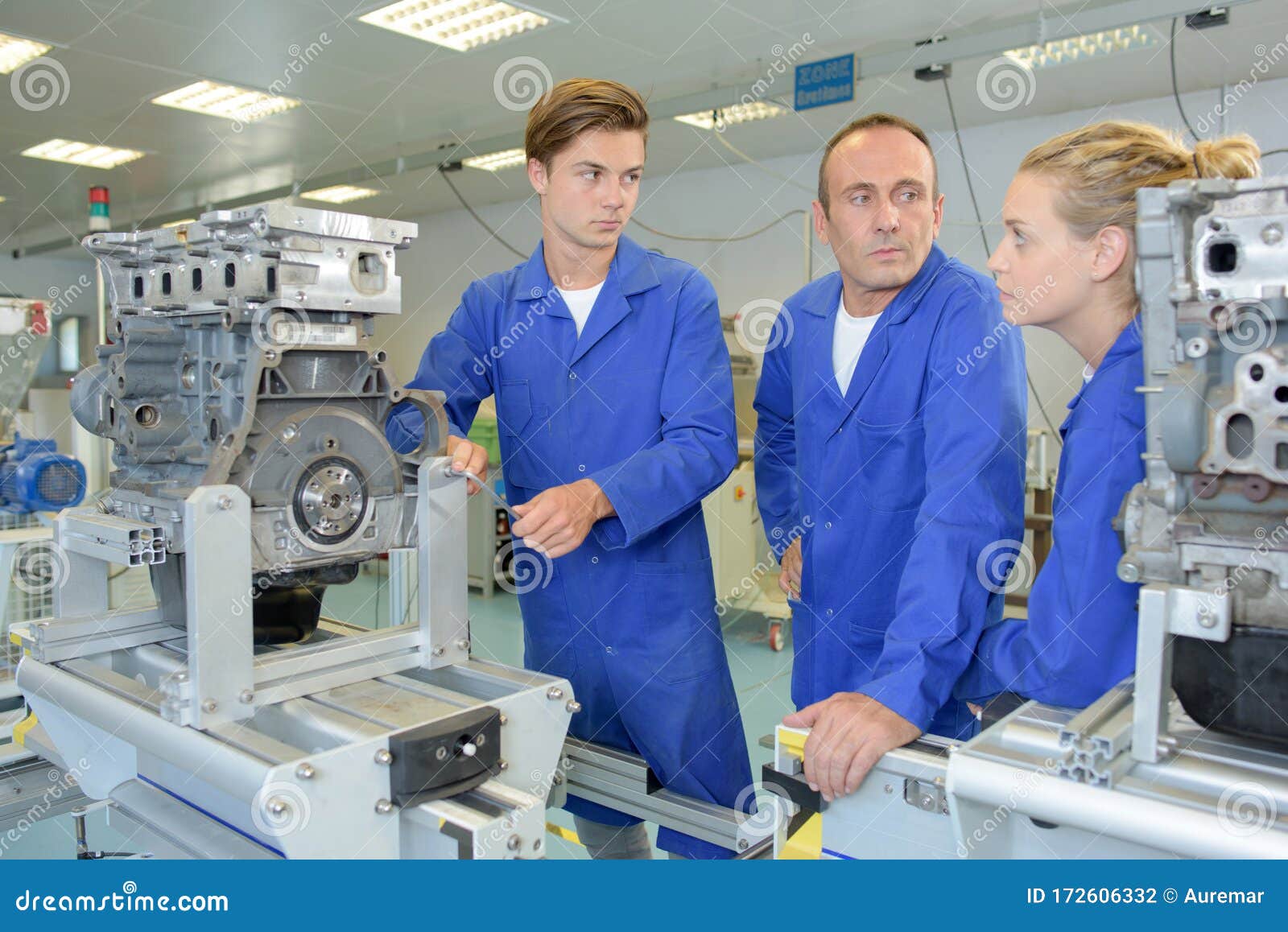 Engineering Apprentices with Instructor Stock Photo - Image of ...
