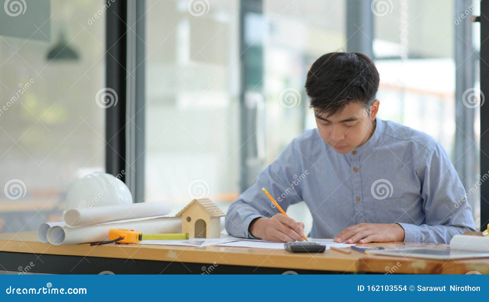 Engineering is Checking the Floor Plan in the Office with Equipment ...