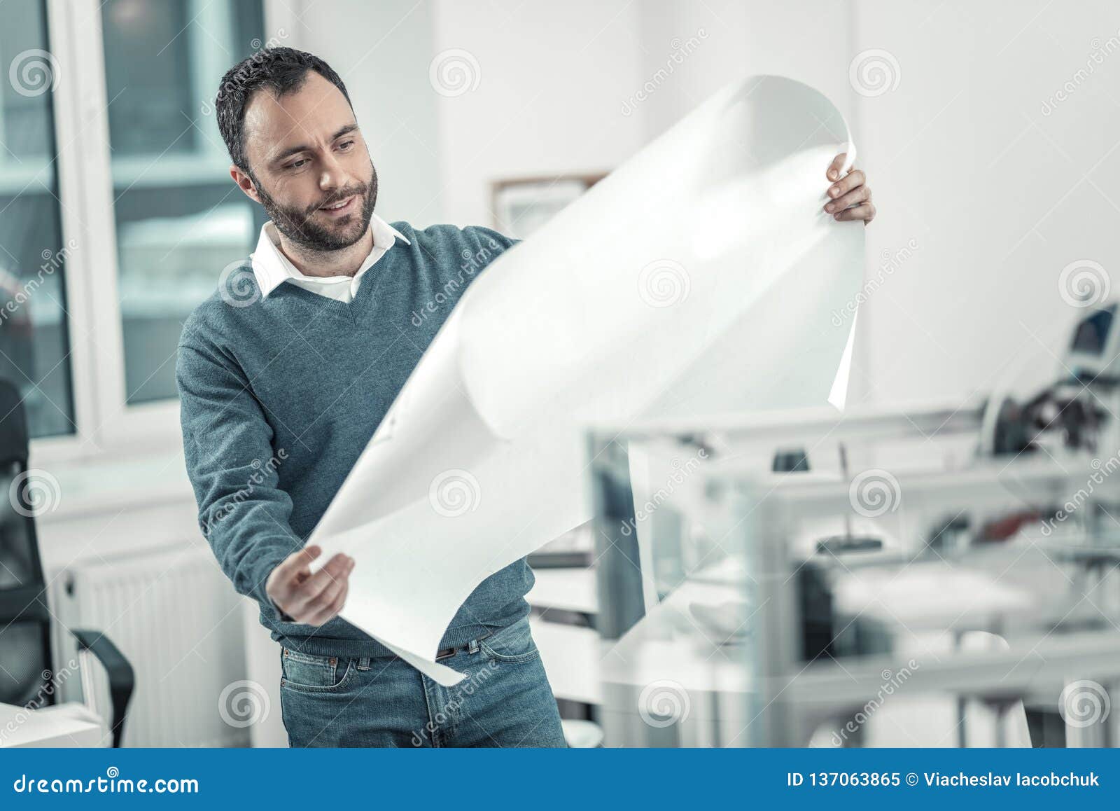 Delighted Handsome Nice Man Holding a Blueprint Stock Image - Image of ...