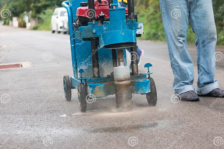 Engineering is Drilling the Road by Road Drilling Machine Stock Photo ...