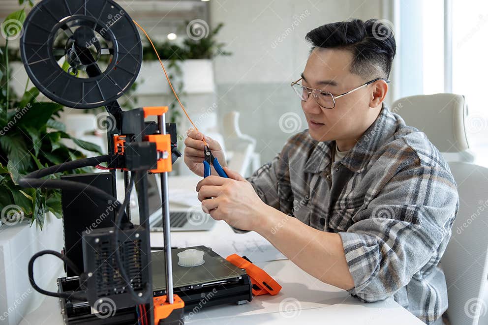 Engineering Man Designing Mechanical Parts Using 3D Printer in Office ...