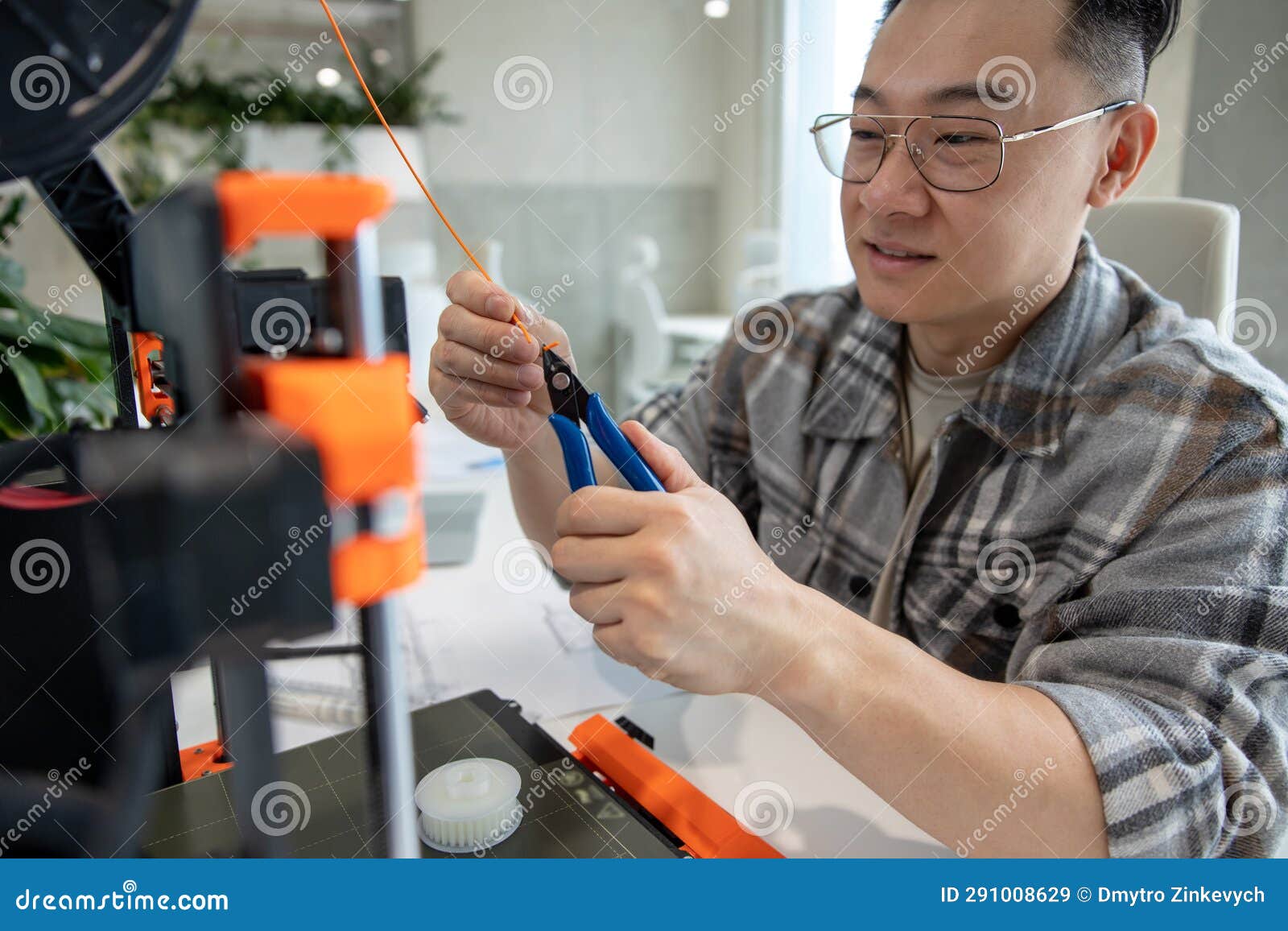 Engineering Man Designing Mechanical Parts Using 3D Printer in Office ...