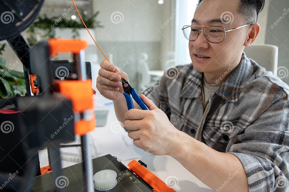 Engineering Man Designing Mechanical Parts Using 3D Printer in Office ...