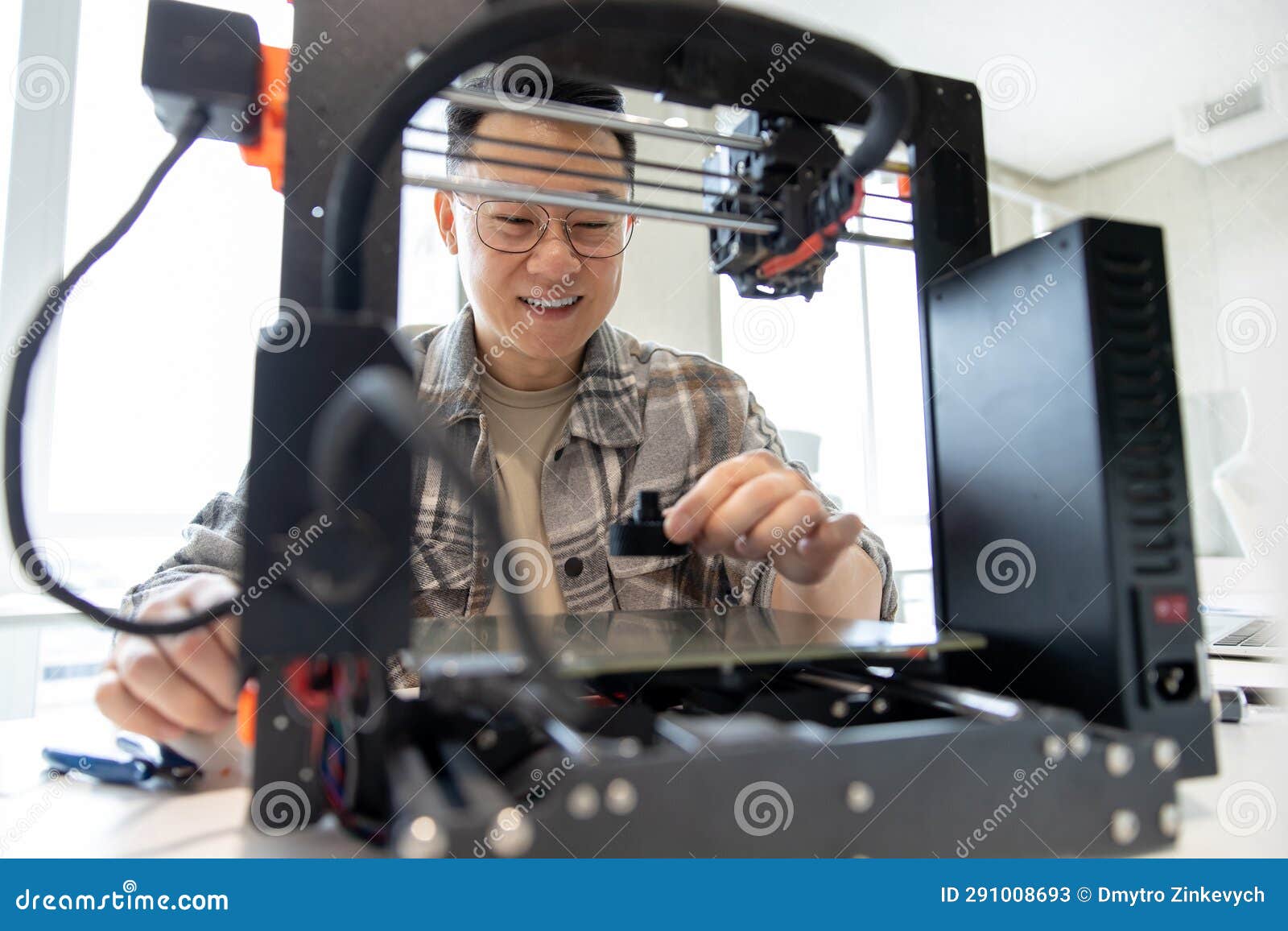 Engineering Man Designing Mechanical Parts Using 3D Printer in Office ...
