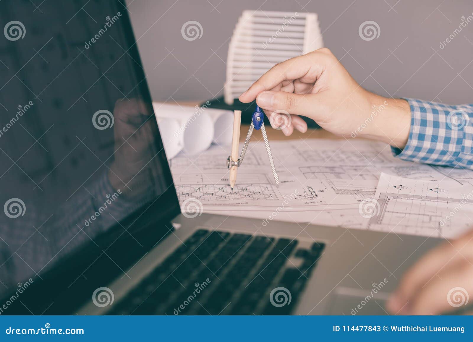 Engineering Man Hand Drawing on Blueprint and Using Laptop. Stock Image ...