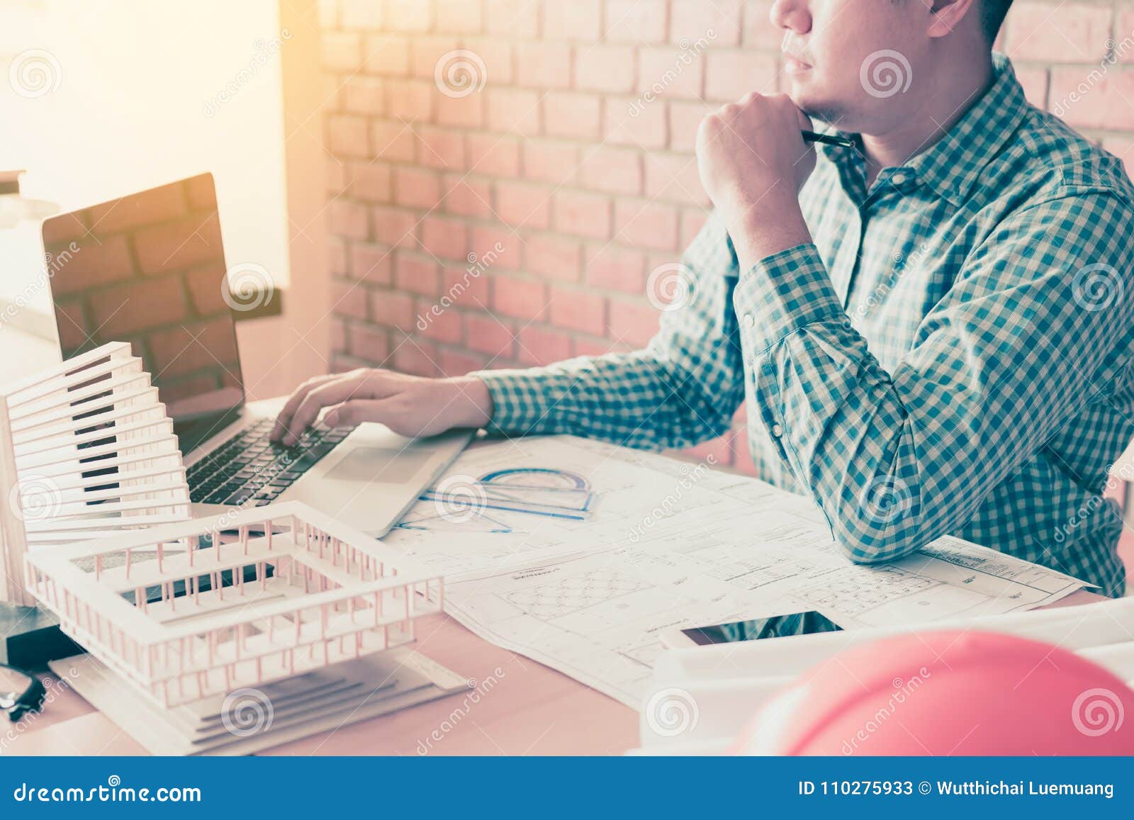 Engineering Man Looking on Laptop Screen and Analysis Calculate Stock ...